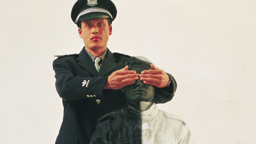 Chinese Artist Attempts To Blend In ... Literally : The Picture Show : NPR