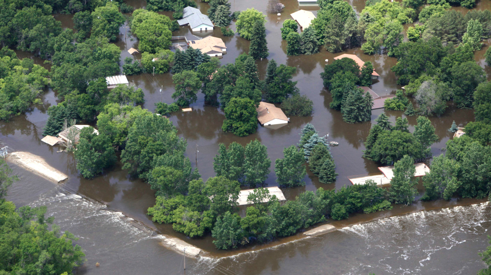 Two Towns, Same Flooded River, Different Fates : NPR