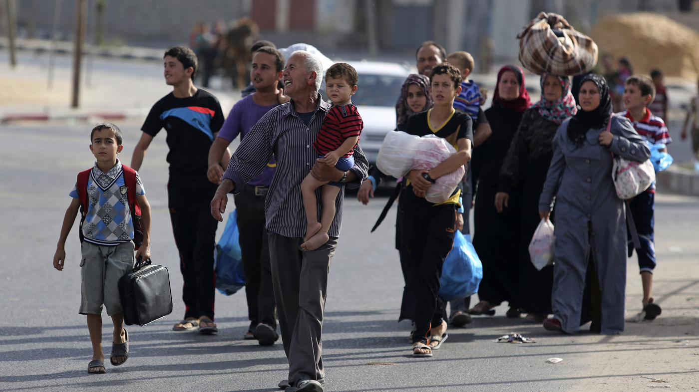Palestinians Flee Gaza After Israel Drops Warning Leaflets : The Two ...
