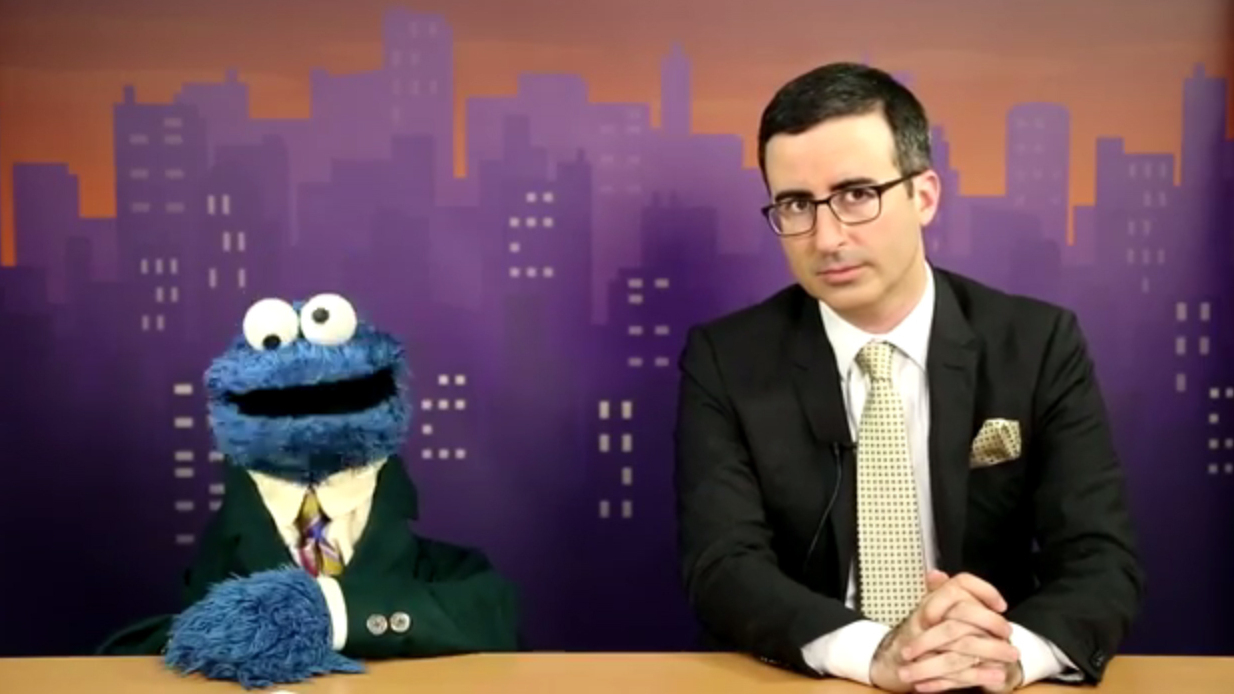 John Oliver And Cookie Monster, On The News Beat : The Two-Way : NPR
