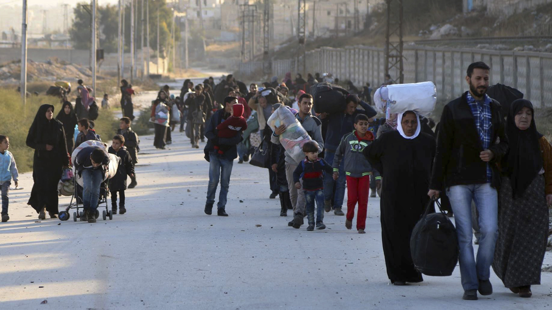PHOTOS: Mass Exodus From Aleppo's Rebel Stronghold As Regime Forces ...
