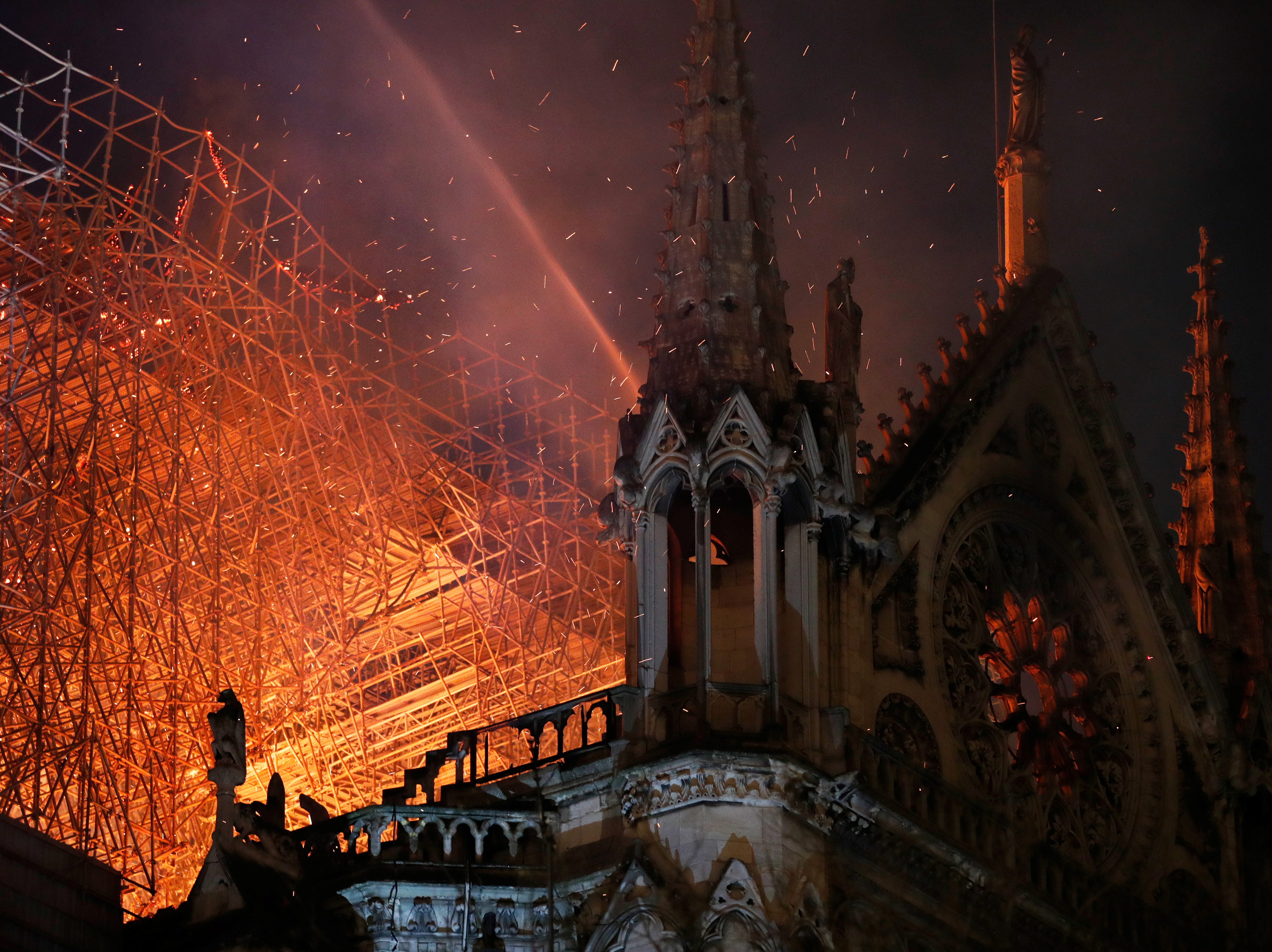 Notre Dame Cathedral Fire Extinguished; Spire Collapsed, Towers Still ...