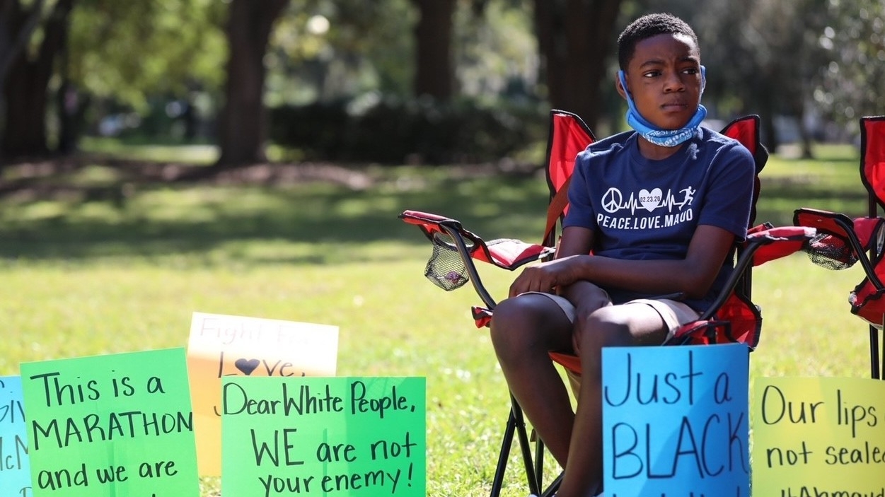 Family of Ahmaud Arbery leads rally ahead of trial of men charged in ...