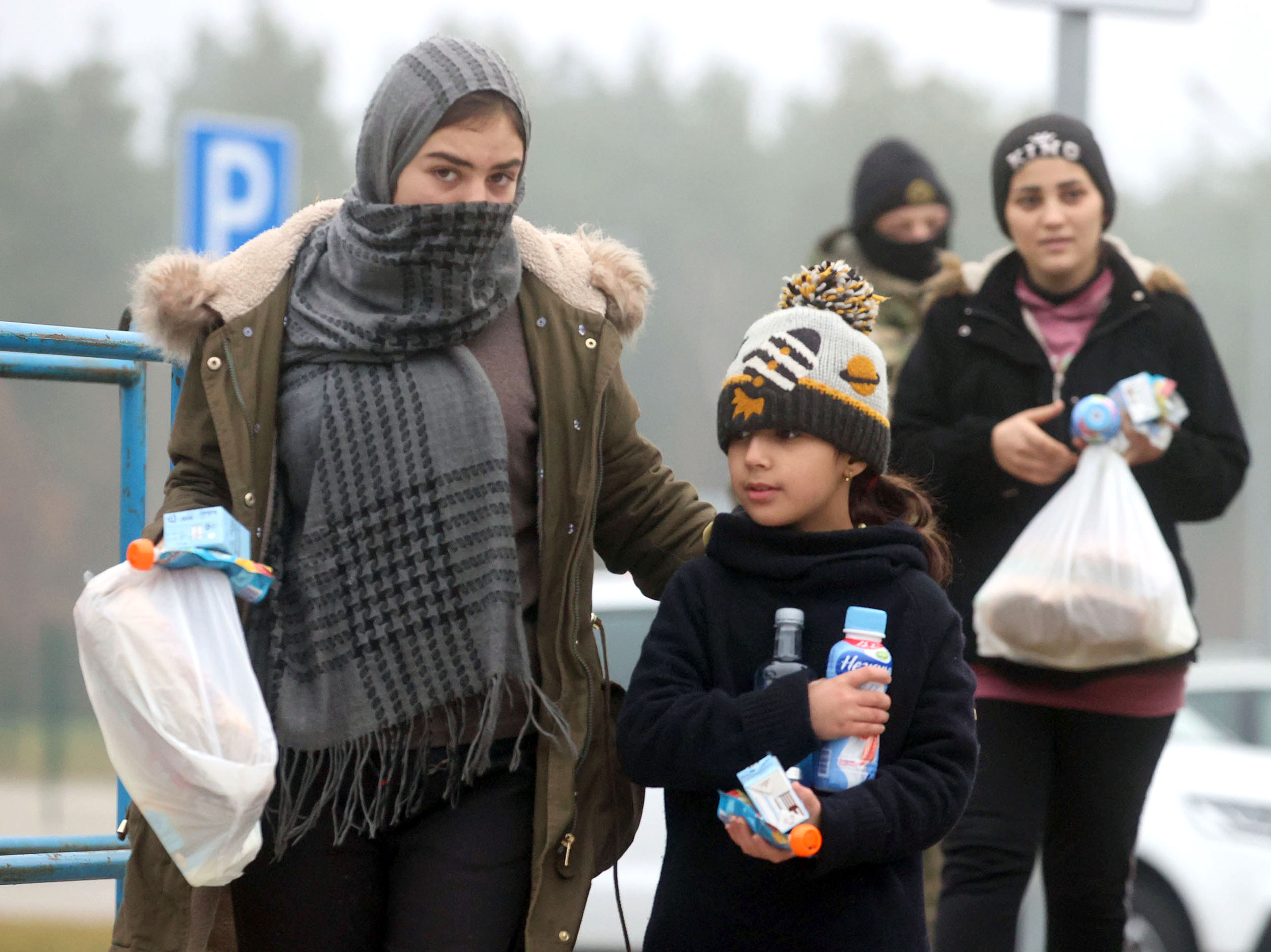 How a political standoff trapped hundreds of migrants at the Belarus ...