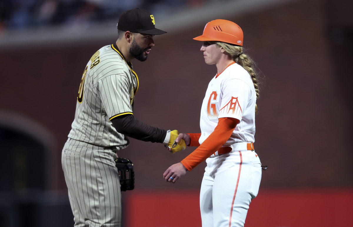 Alyssa Nakken becomes the first woman to coach on the field in MLB ...