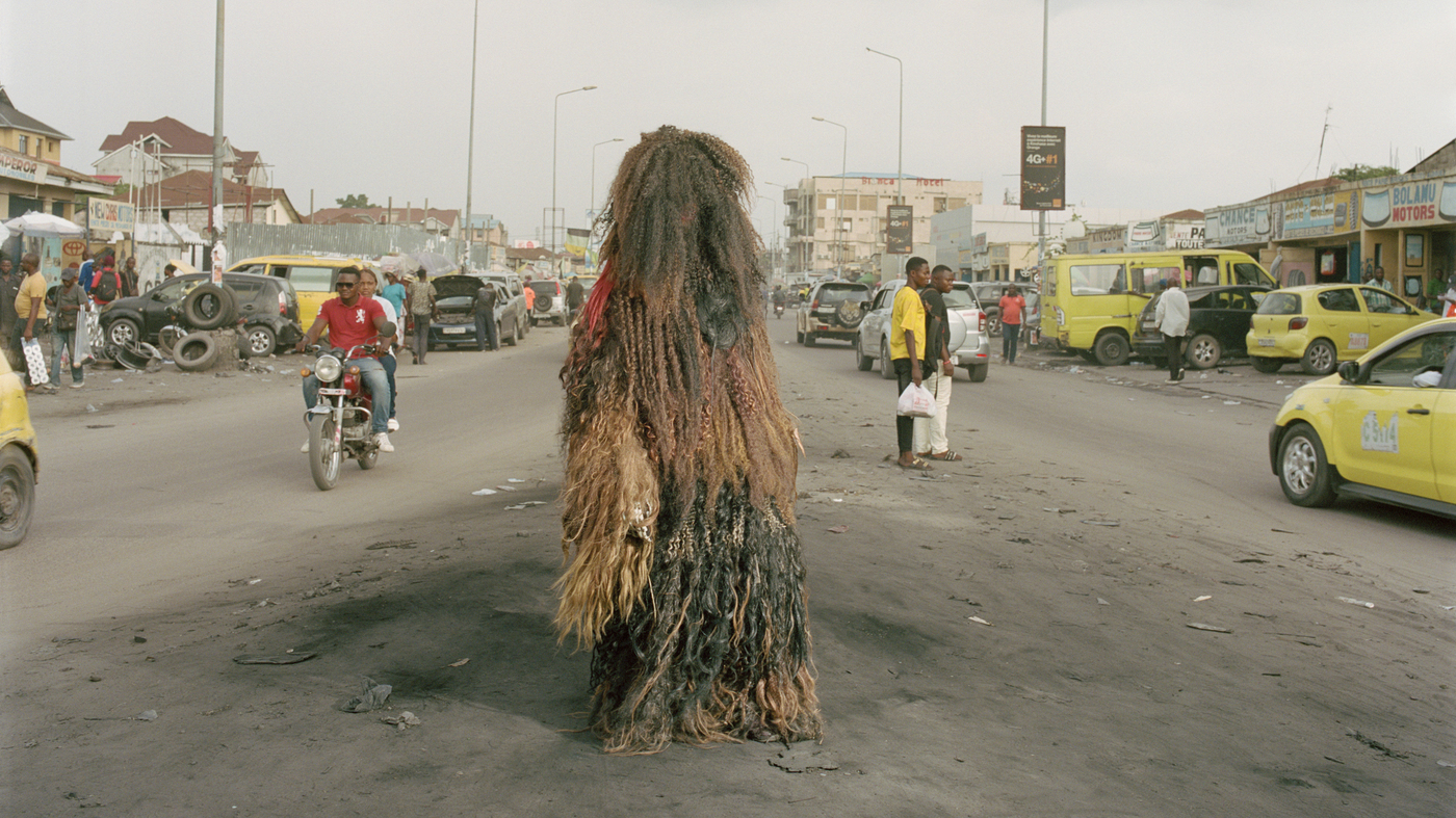 Artists highlight a city's woes with fantastical costumes made out of ...
