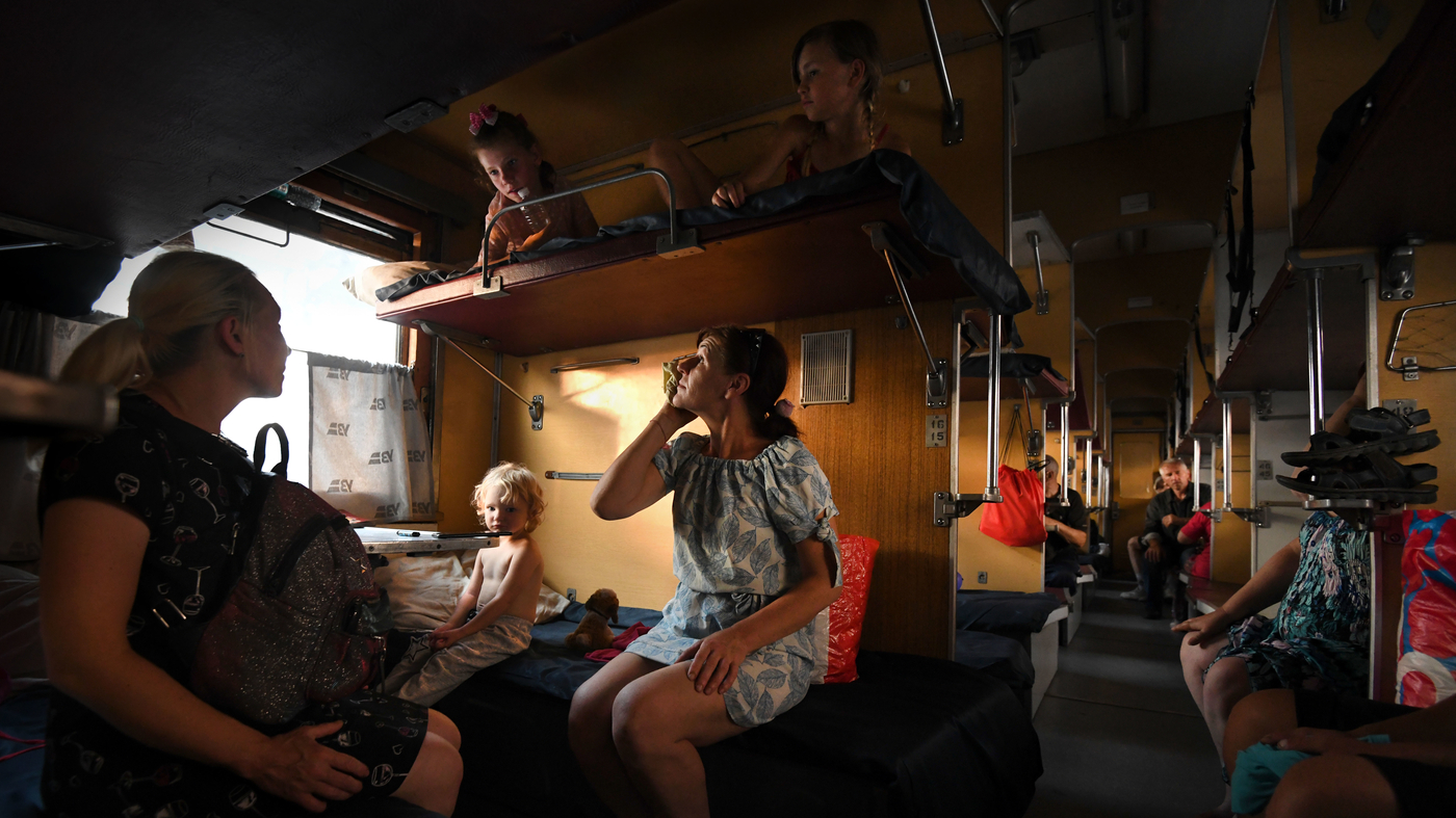 Riding Ukraine's last train line out of Donbas with families fleeing ...