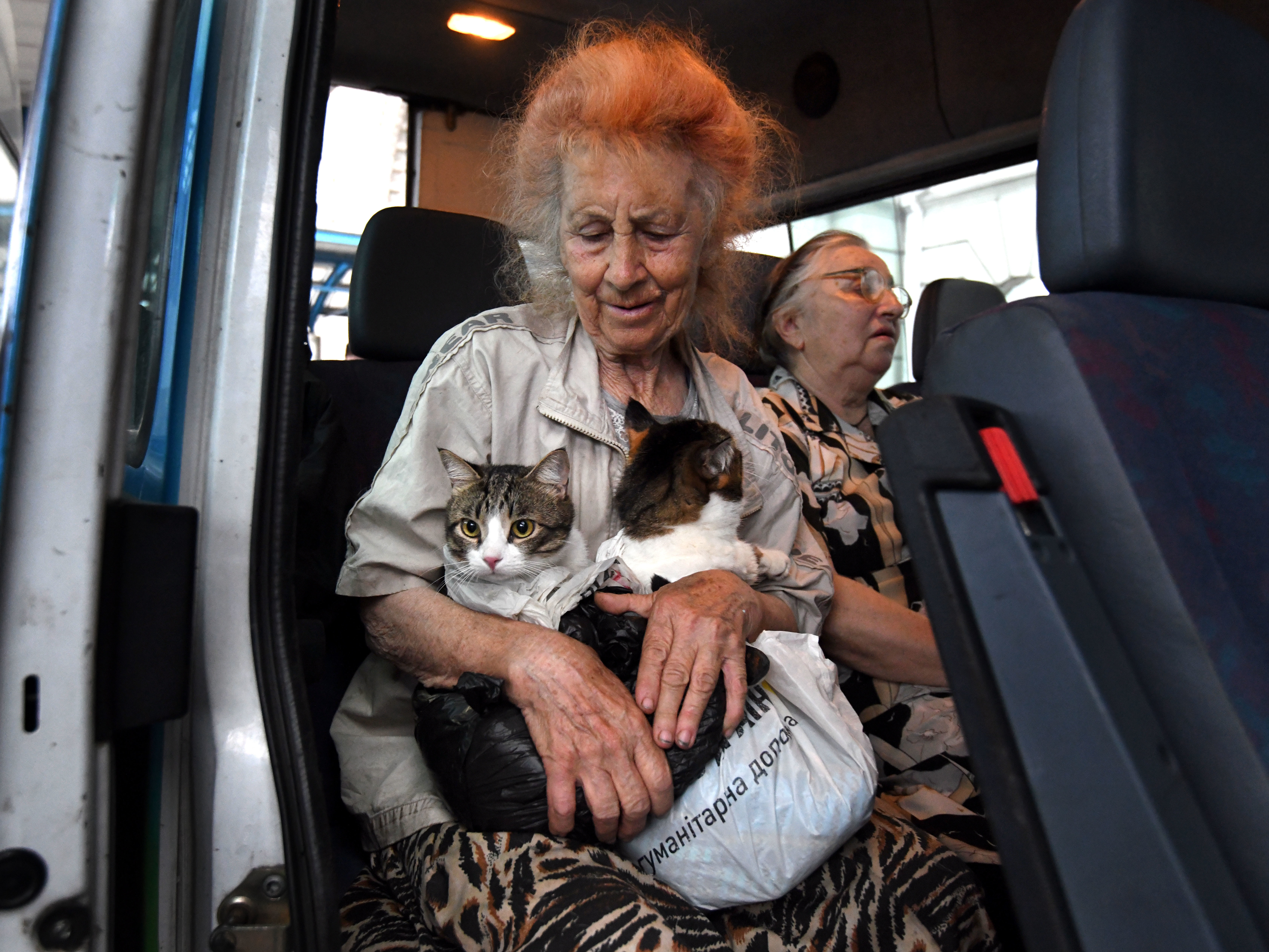 Riding Ukraine's last train line out of Donbas with families fleeing ...