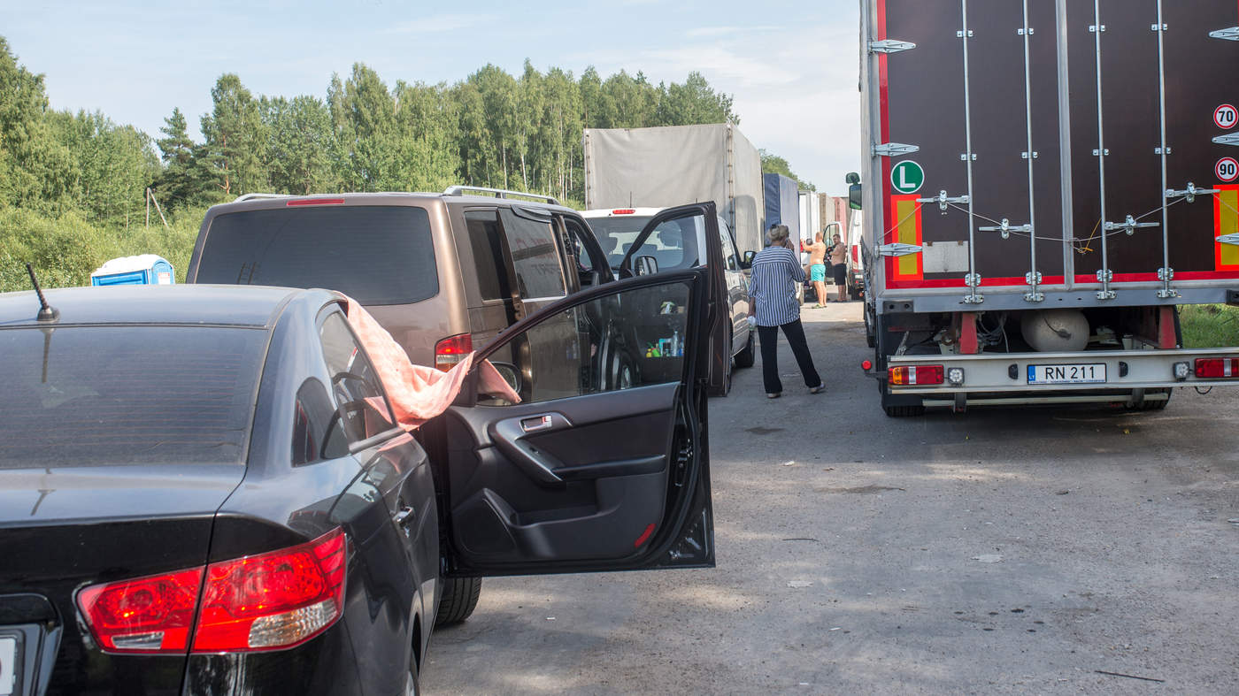 At Latvia's border with Russia, the line grows long, and tempers short ...