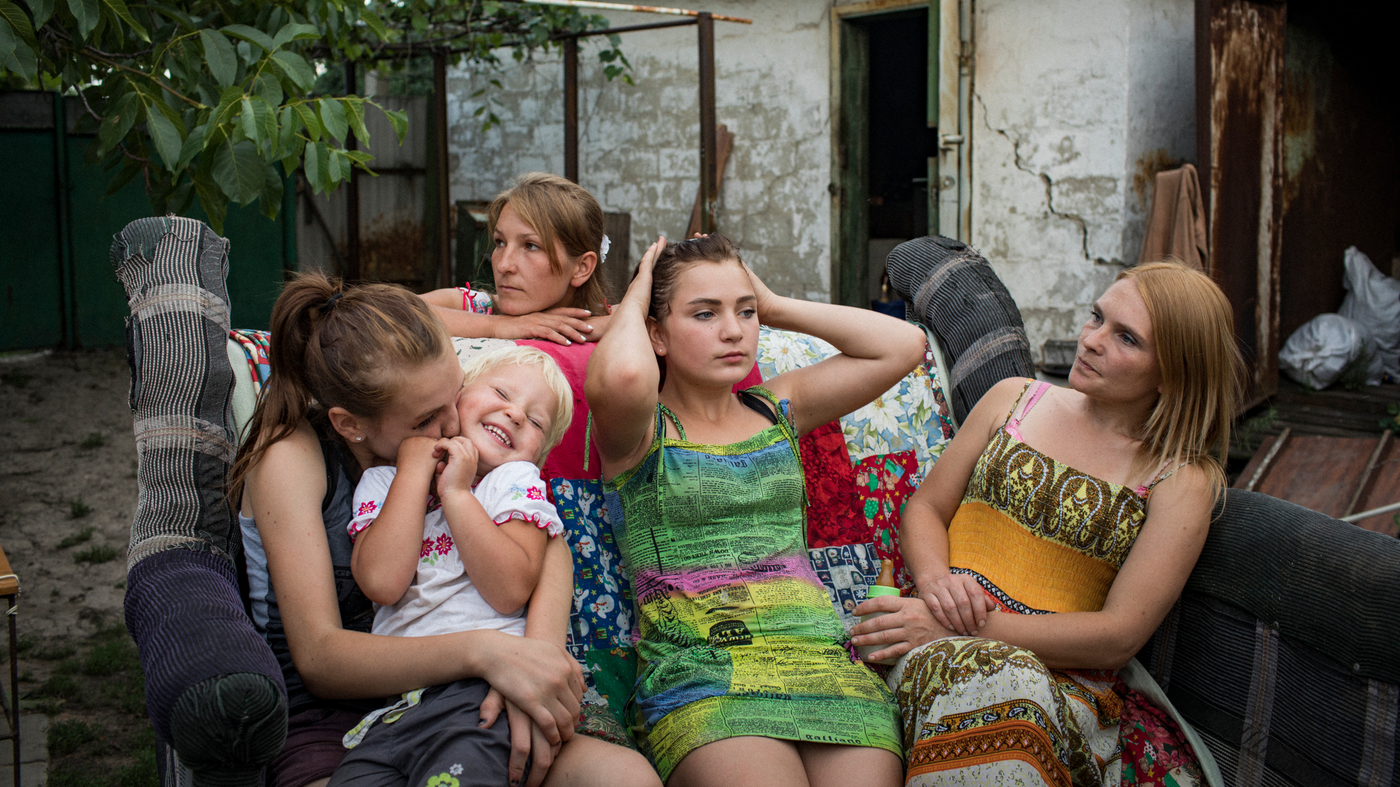 The Ukraine war isn't new. These intimate photos show 3 families enduring it for years : The ...
