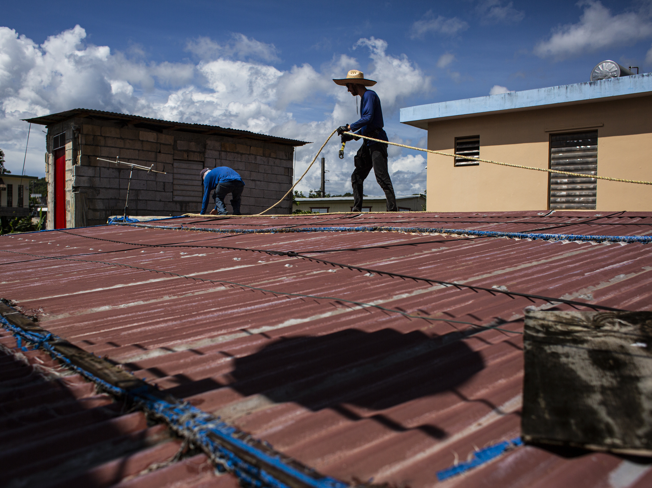 Hurricane-damaged roofs in Puerto Rico remain a problem. One group is ...