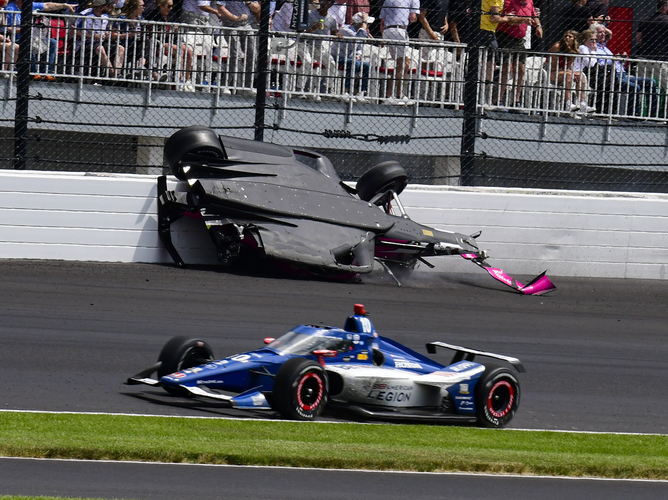 A crash at the Indy 500 sent a tire careening past the fan-packed ...