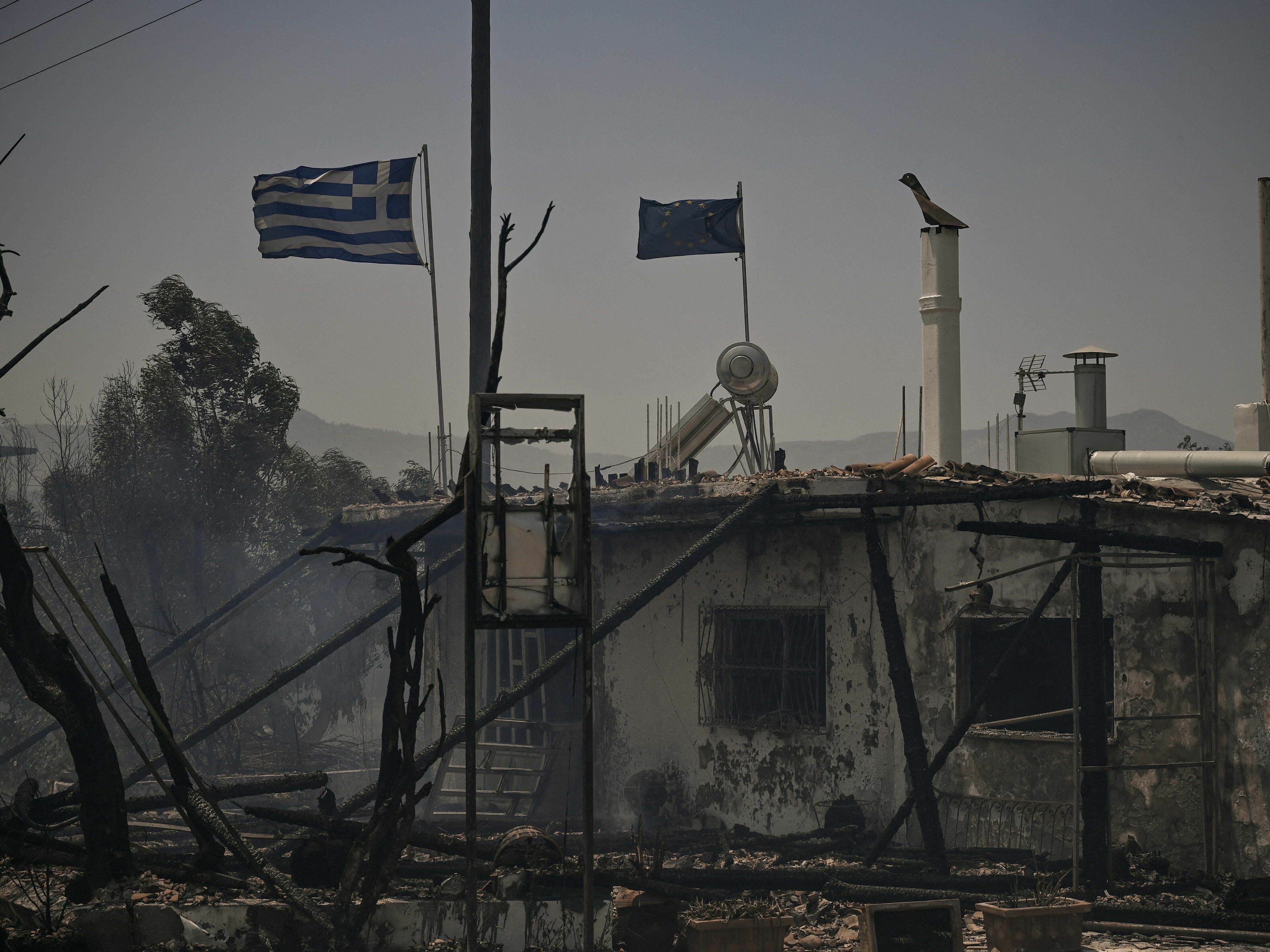 Wildfires in Greece prompt massive evacuations, leaving tourists in ...