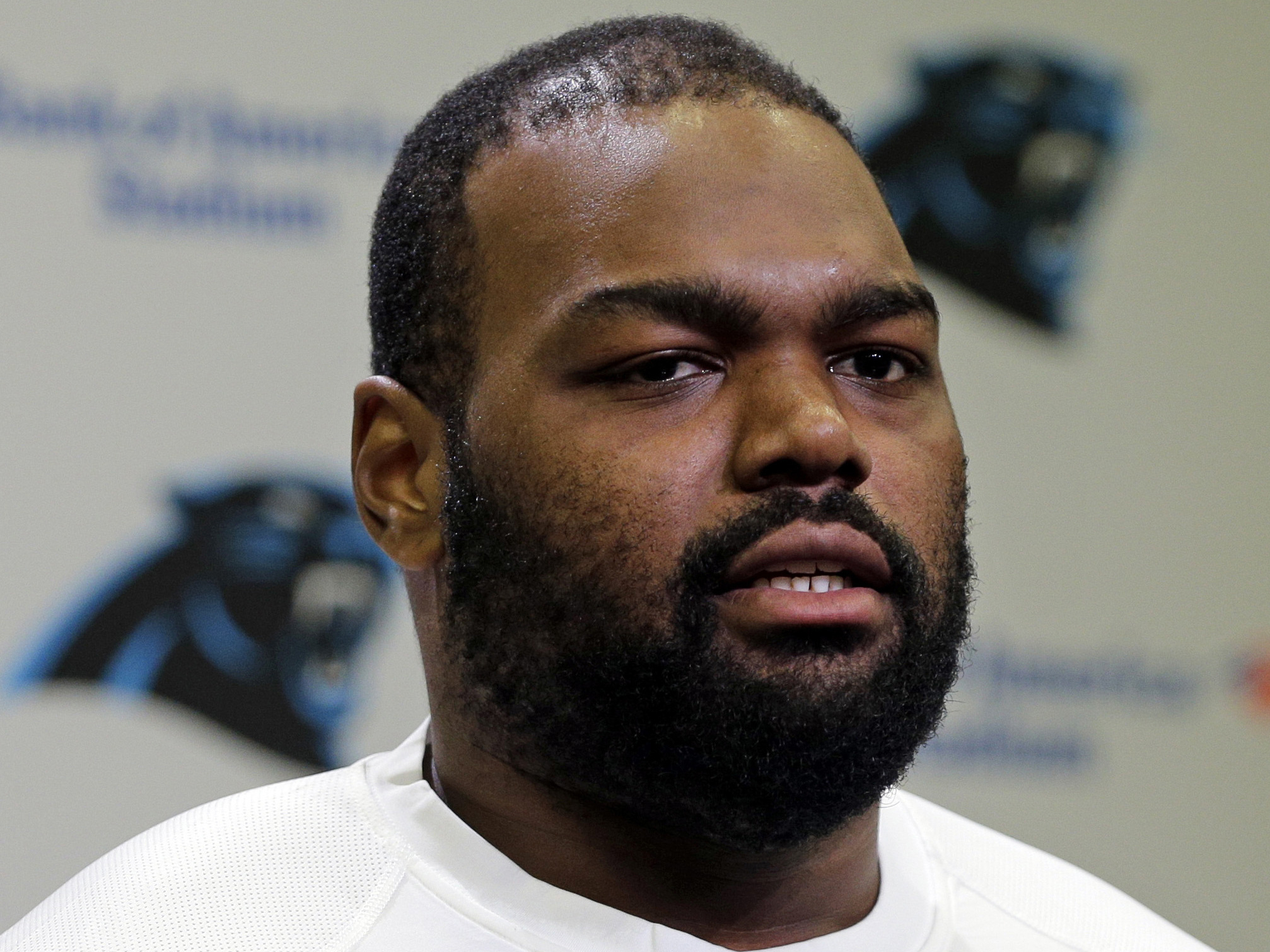 Michael Oher of 'The Blind Side' says he wasn't adopted, but put in a ...