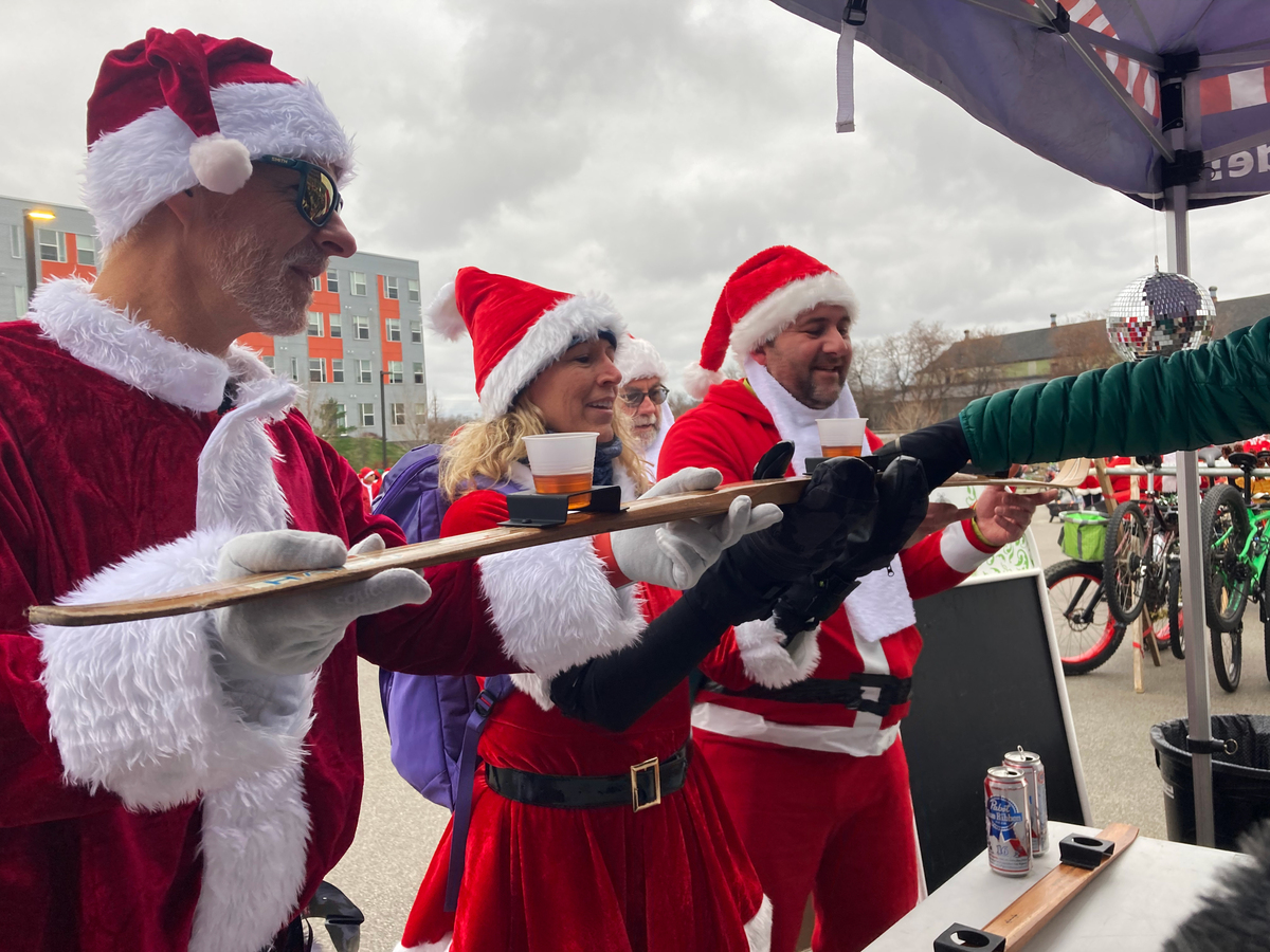Thousands of Santas swarm downtown Milwaukee for bike charity event : NPR