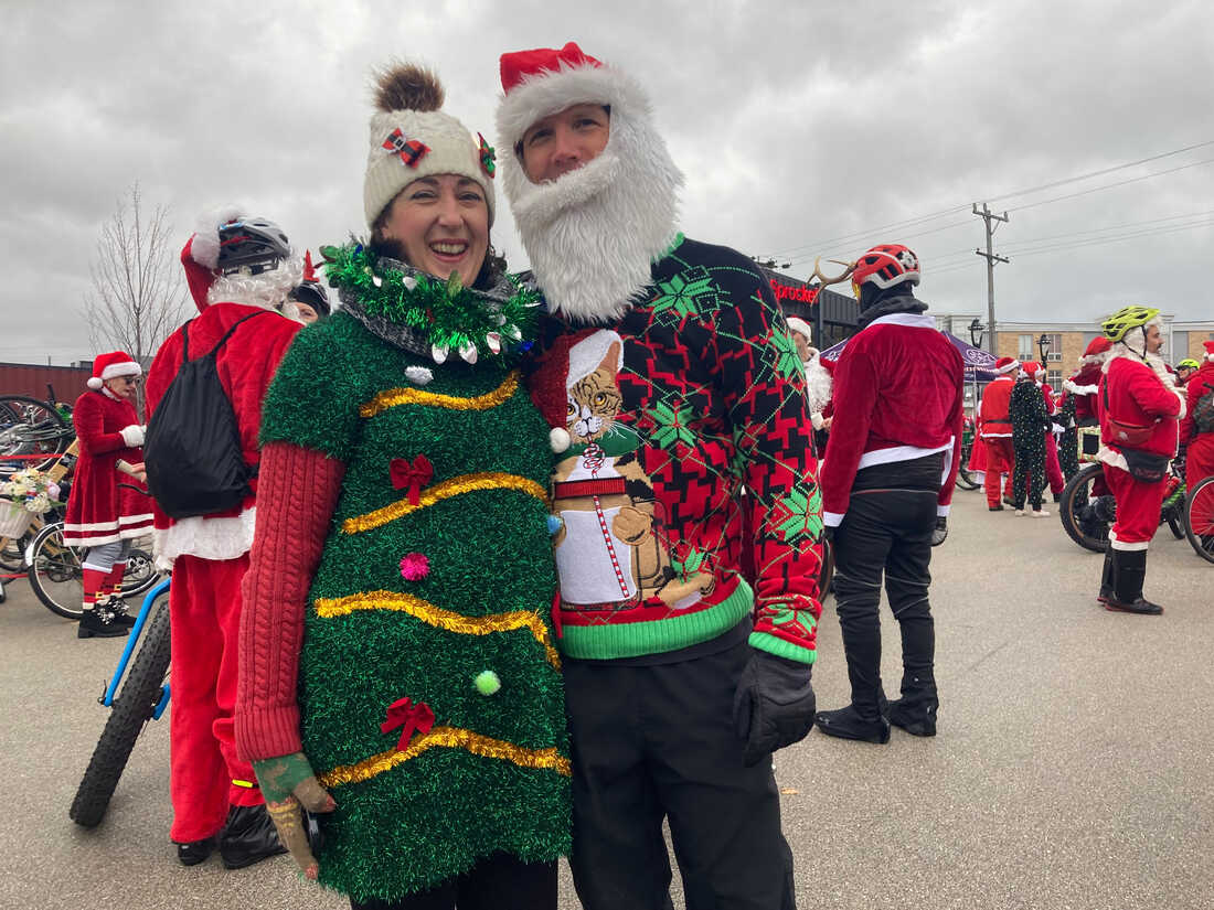 Thousands of Santas swarm downtown Milwaukee for bike charity event : NPR