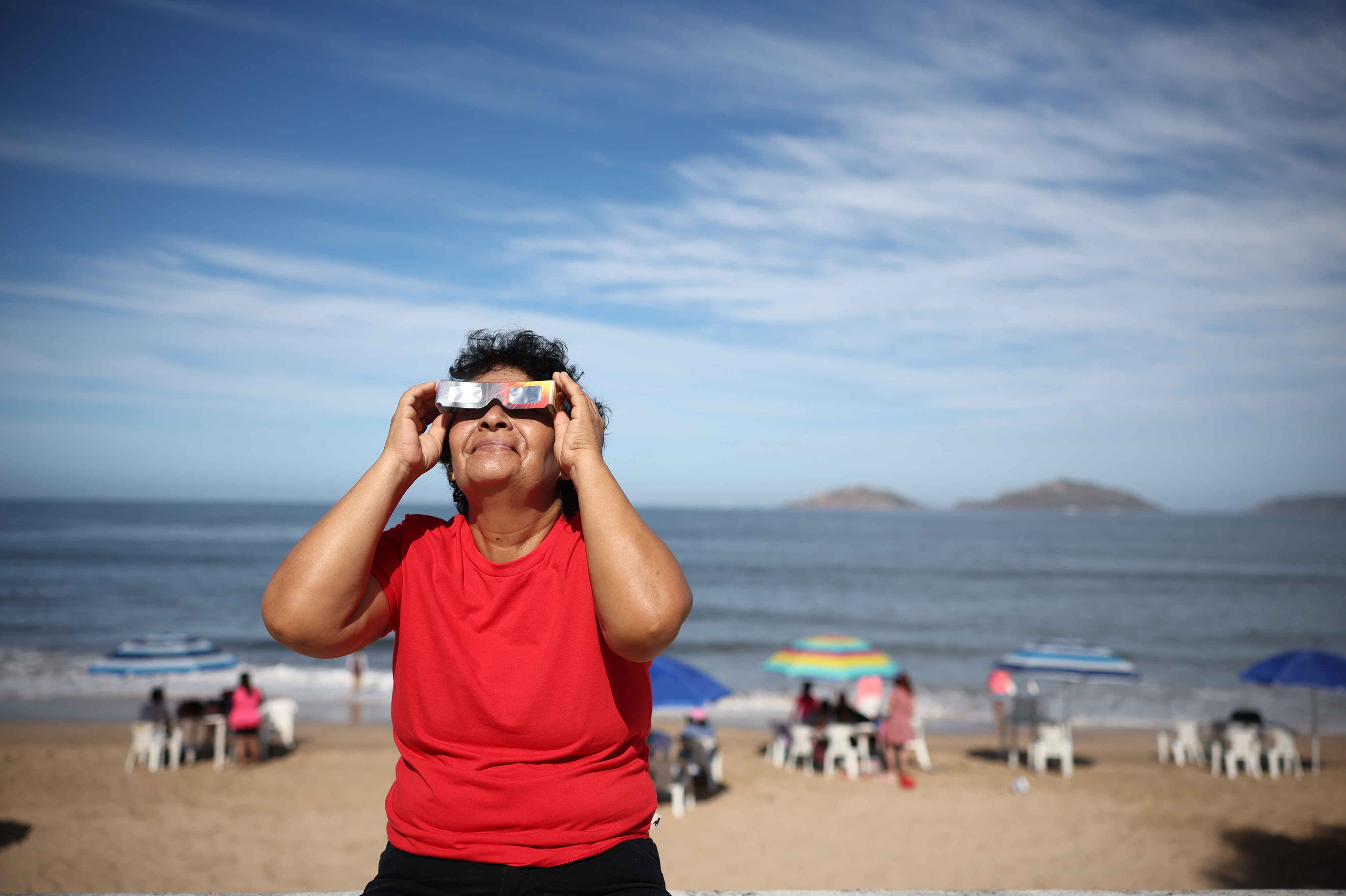 Mexico's beach party is excited to see the eclipse first emerge | WBUR