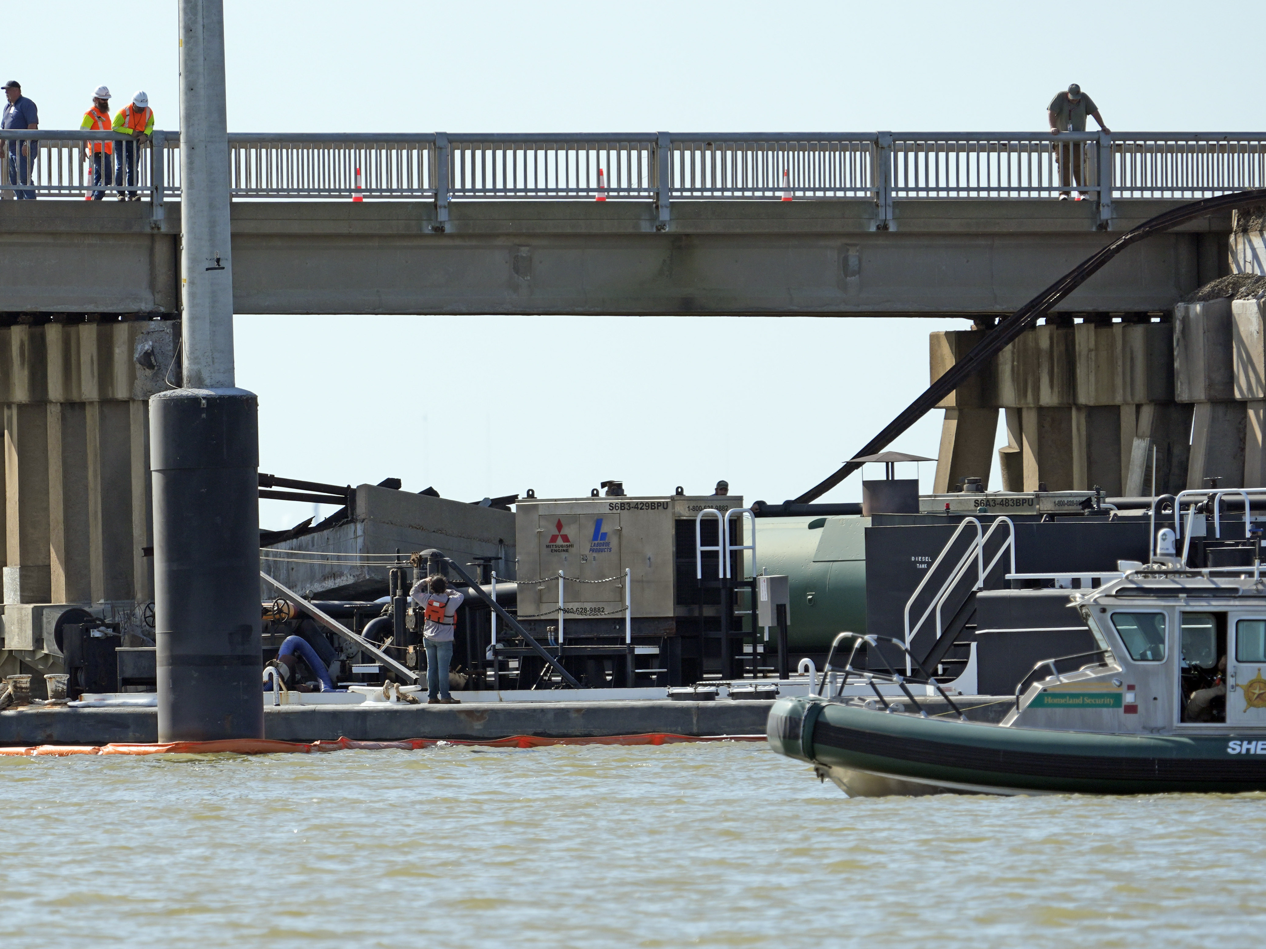 Barge hits bridge connecting Galveston and Pelican Island, causing oil ...