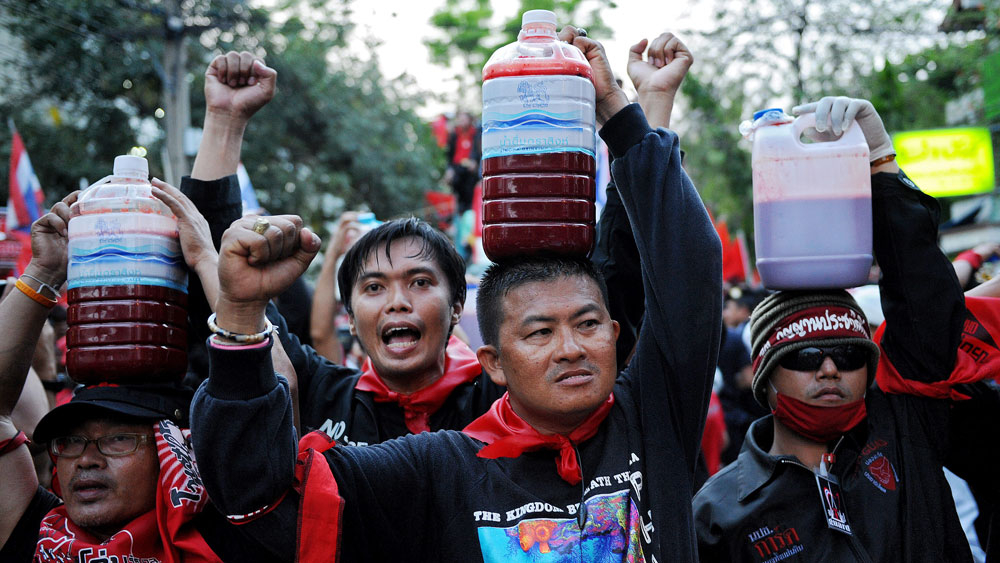 Thai Protesters Spill Own Blood At Government Gates : NPR